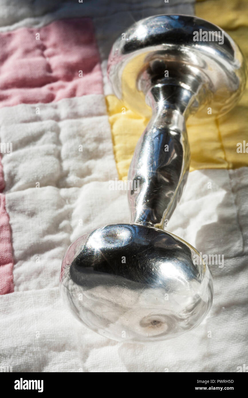 Silver baby rattle hi-res stock photography and images - Alamy