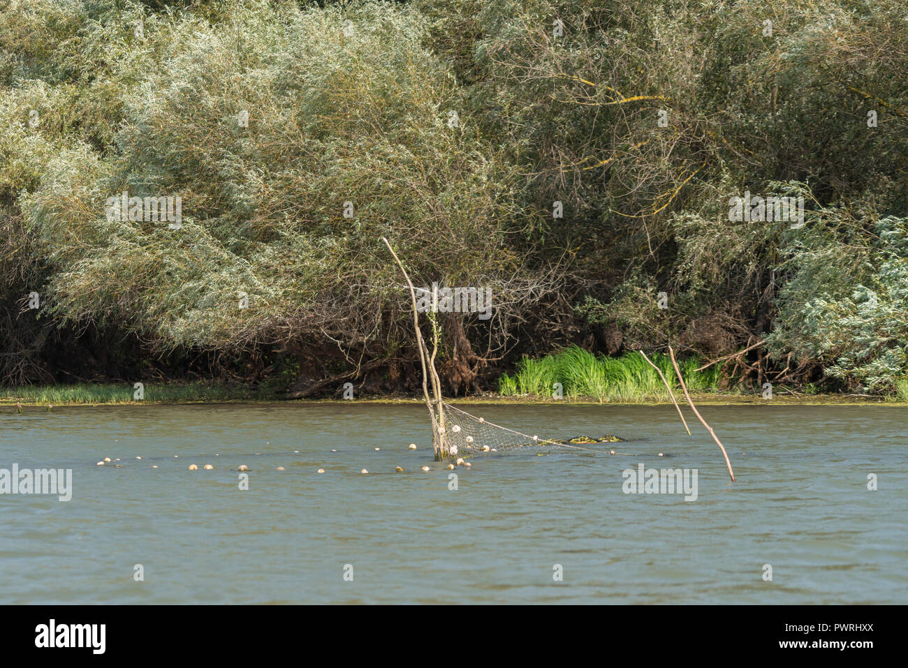 Traditional way of fishing in the Danube Delta Stock Photo - Alamy