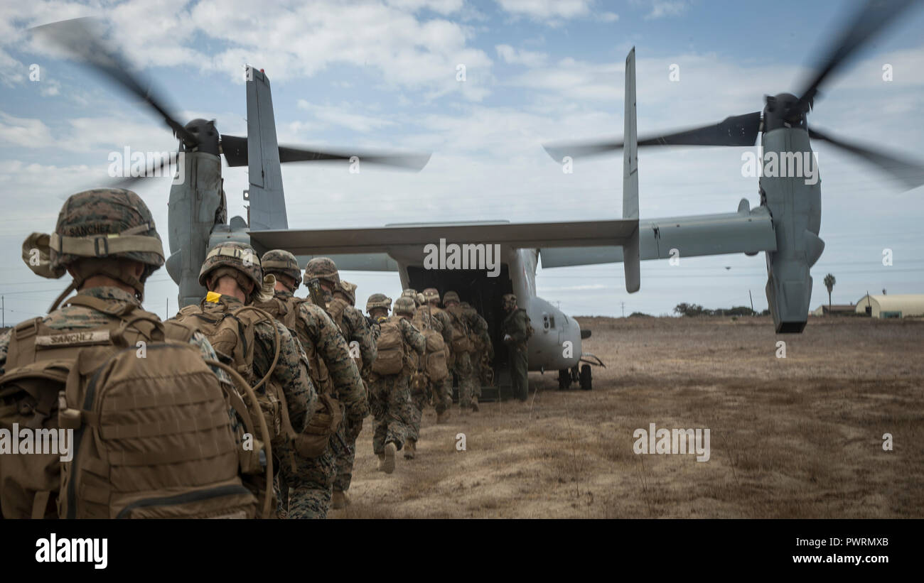 Marines with Kilo Company, 3rd Battalion, 5th Marine Regiment, board an ...