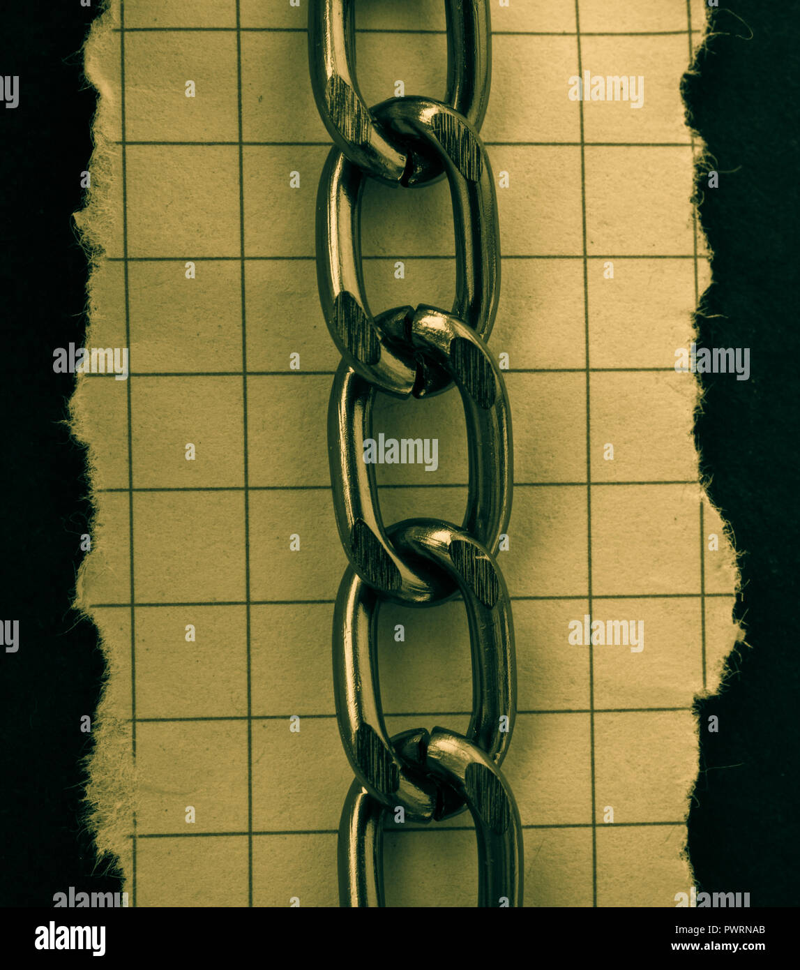 Chain and torn paper on a dark background Stock Photo - Alamy