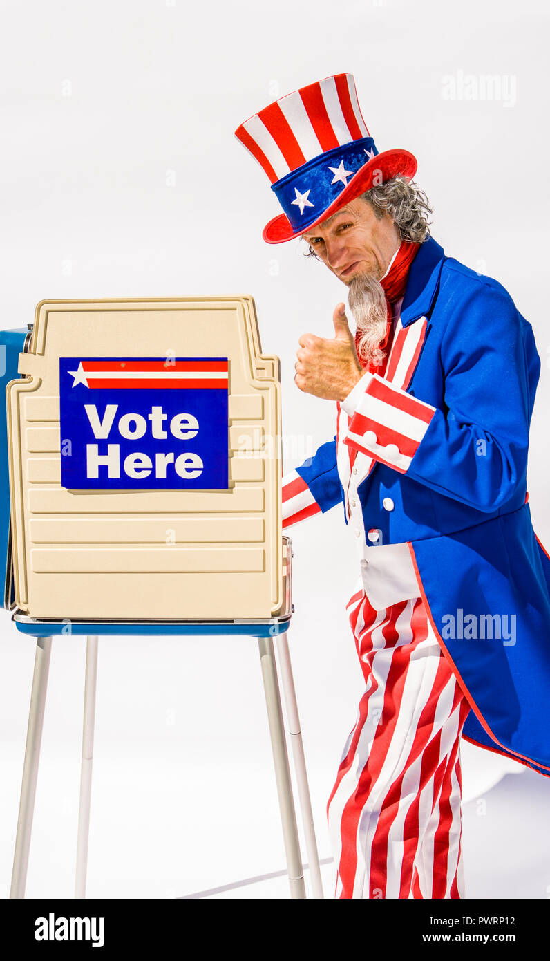 Uncle Sam at a voting booth on white background giving a thumbs up sign ...