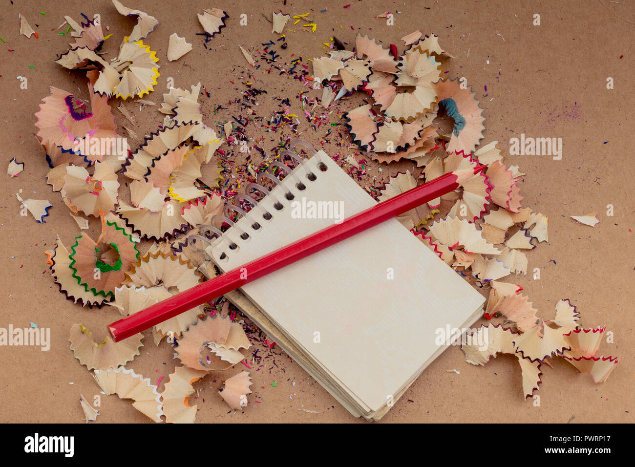 Color pencil on spiral notebooks with pencil trash Stock Photo - Alamy
