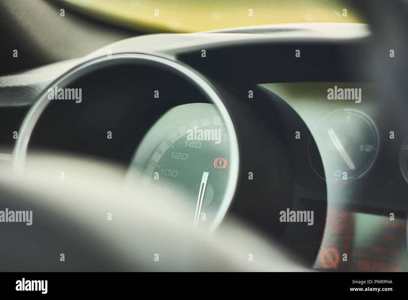Count miles, speedometer, of an Italian car with warning light on ...