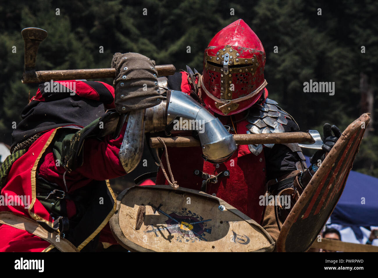 Medieval knights fighting with armor, swords and shields in festival ...