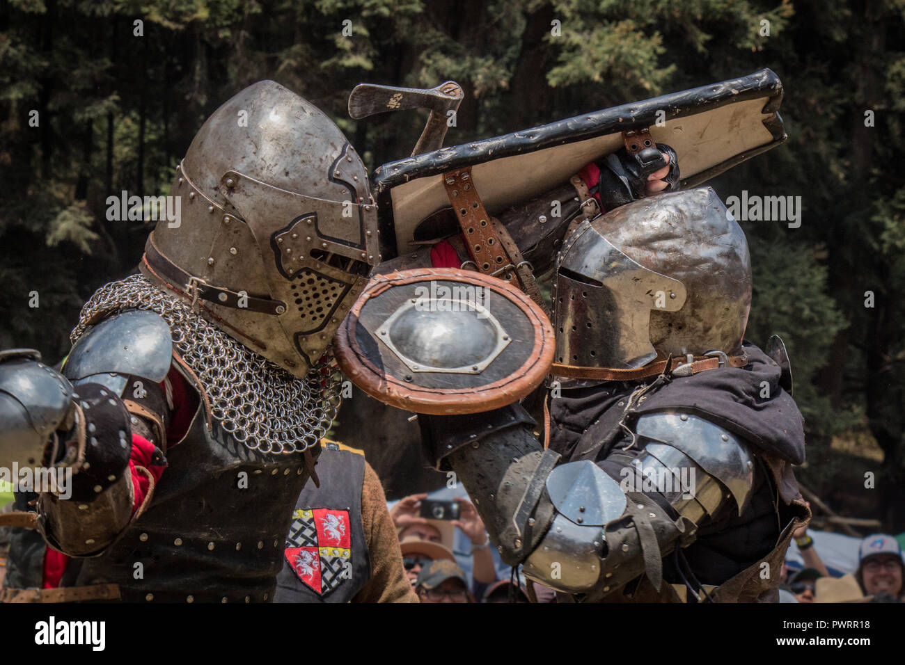 Medieval knights fighting with armor, swords and shields in festival ...