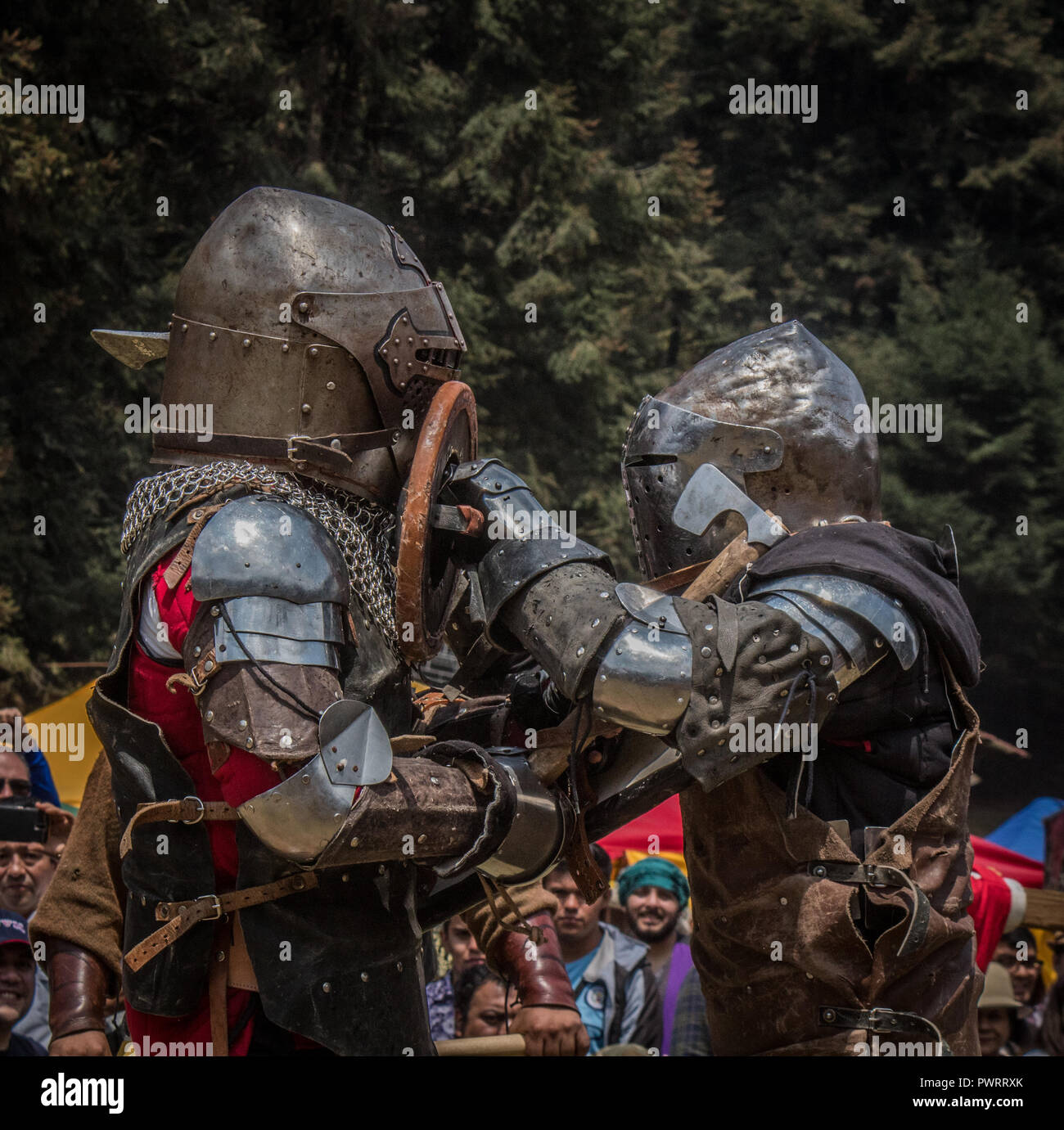 Medieval knights fighting with armor, swords and shields in festival ...