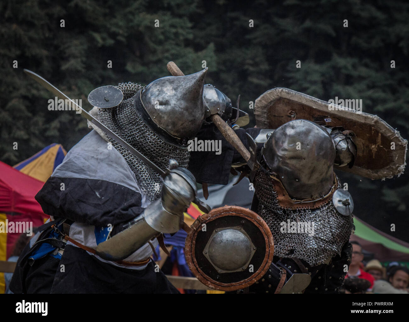 Medieval knights fighting with armor, swords and shields in festival ...