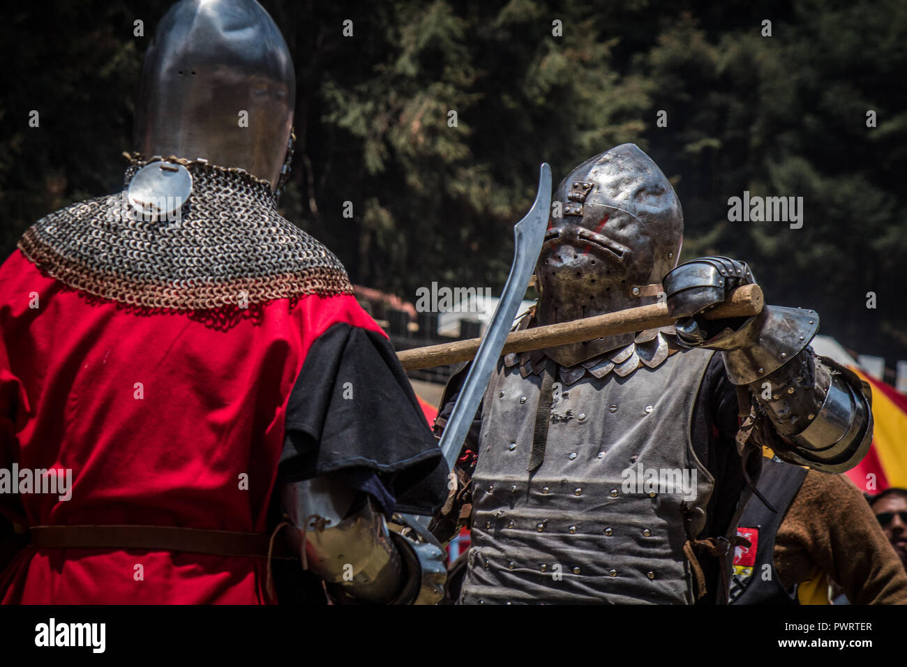 Medieval knights fighting with armor, swords and shields in festival ...