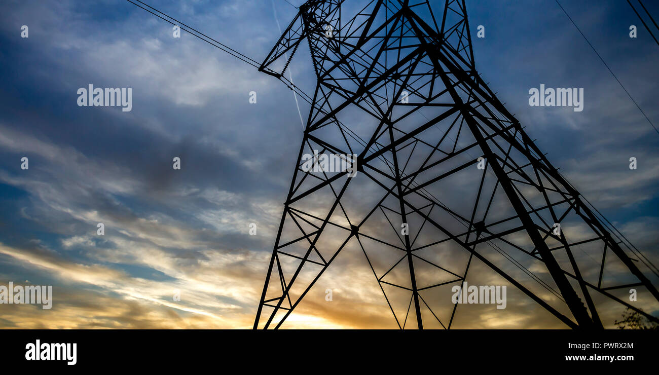 A tall steel tower supporting electrical wires Stock Photo - Alamy