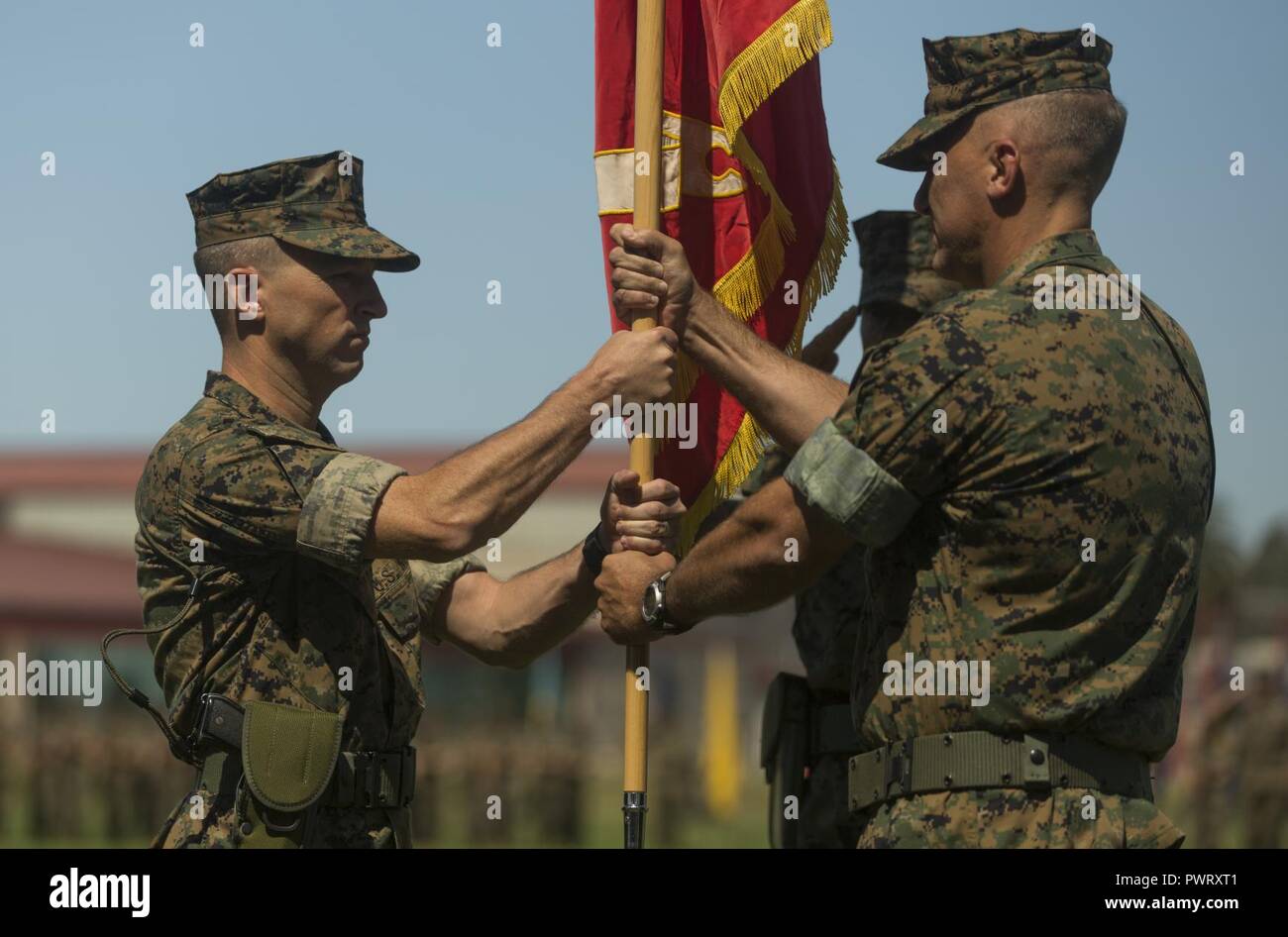 Lt. Col. Seth E. Anderson (right) passes the 1st Intelligence Battalion ...