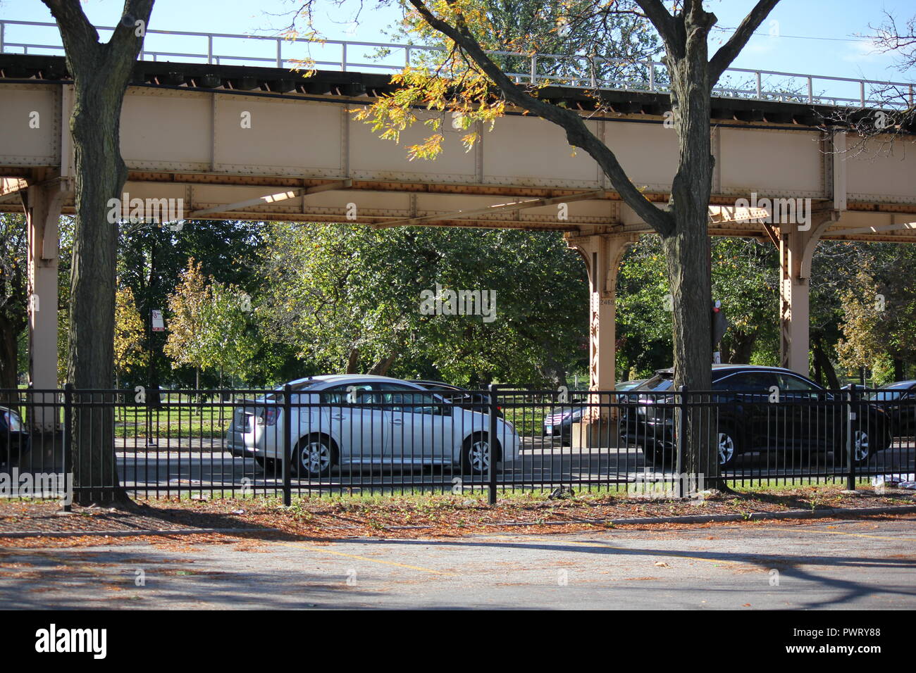Chicago's elevated green line steel girder CTA train tracks in the fall ...