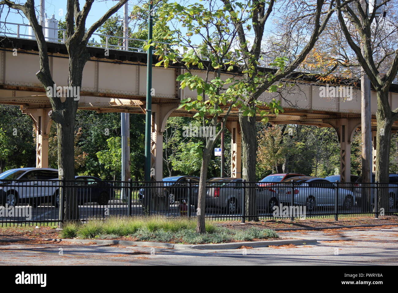 Chicago's elevated green line steel girder CTA train tracks in the fall ...
