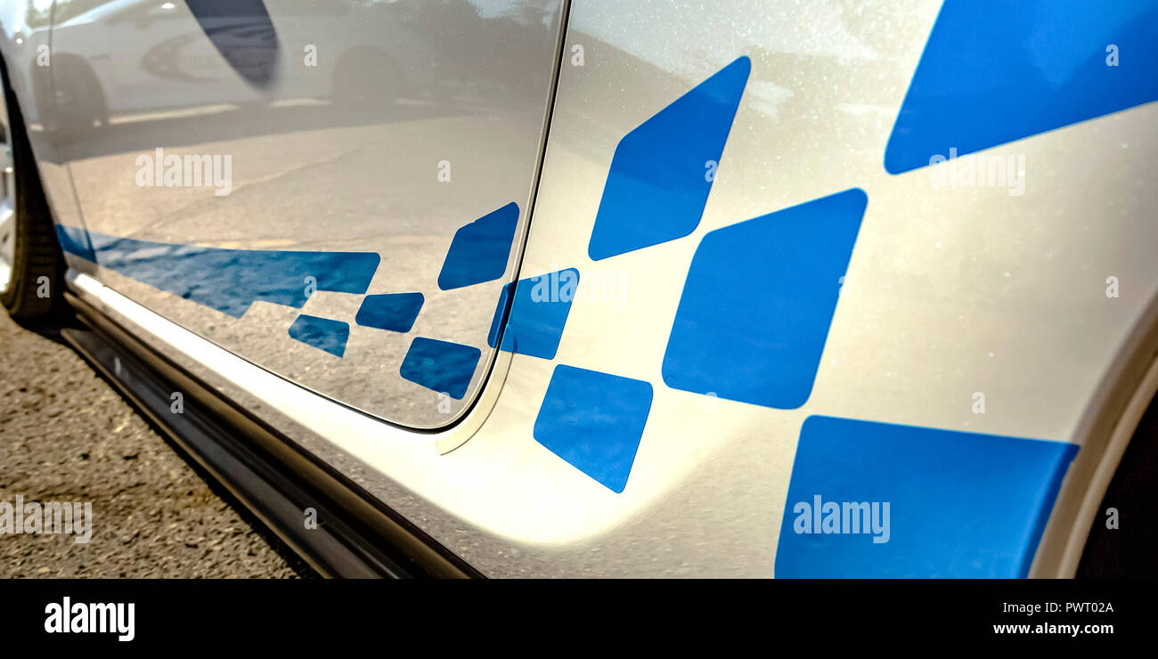 Blue decal on the exterior body of a white car Stock Photo - Alamy