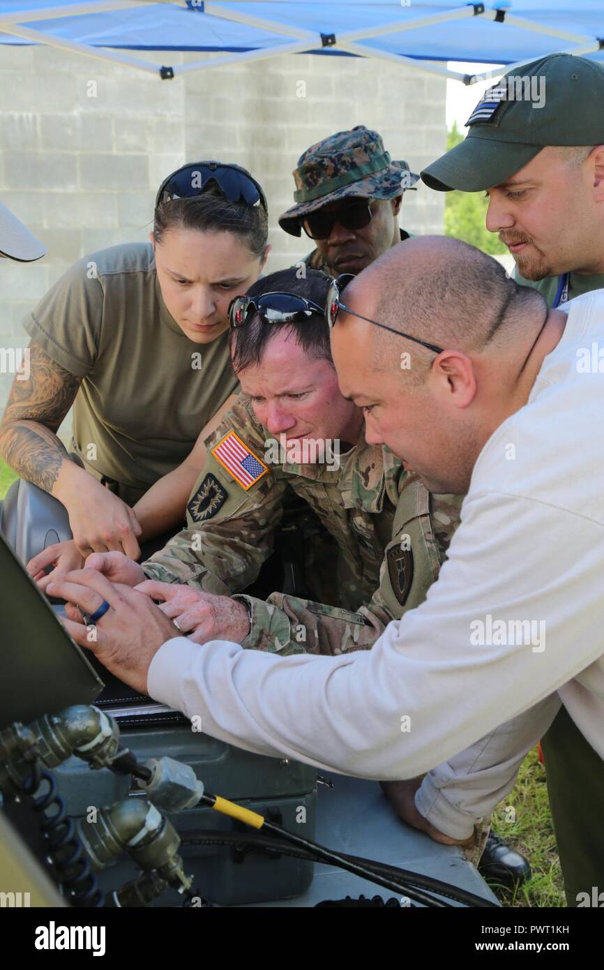 U.S. Soldiers assigned to 705th EOD Company, 63rd EOD Battalion, 52nd ...