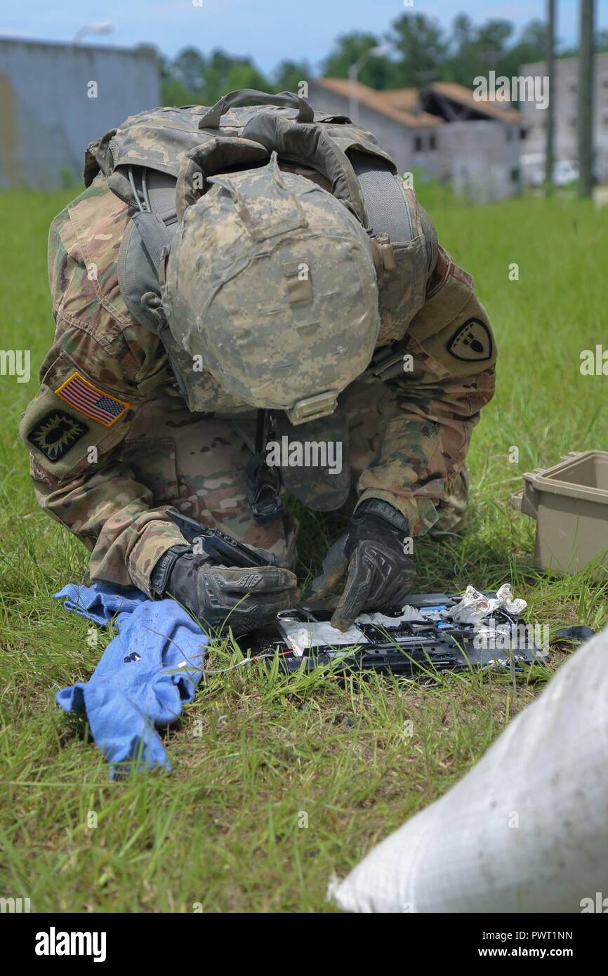 U.S. Army Staff Sgt. Steven Neal, assigned to 705th EOD Company, 63rd ...
