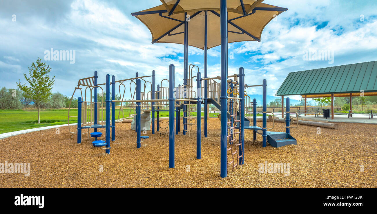 Childrens playground under cloudy sky in Lehi Utah Stock Photo - Alamy