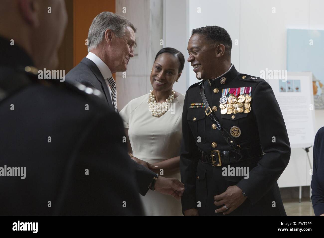 U.S. Senator David A. Perdue, (GA), left, speaks with U.S. Marine Corps ...