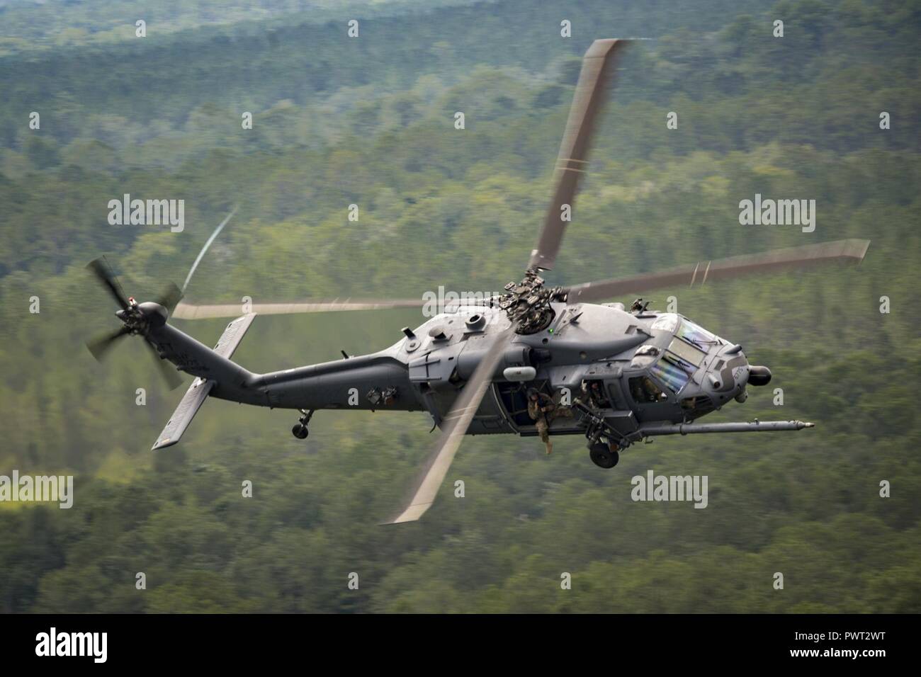 An HH-60G Pave Hawk from the 41st Rescue Squadron flies over Grand Bay ...