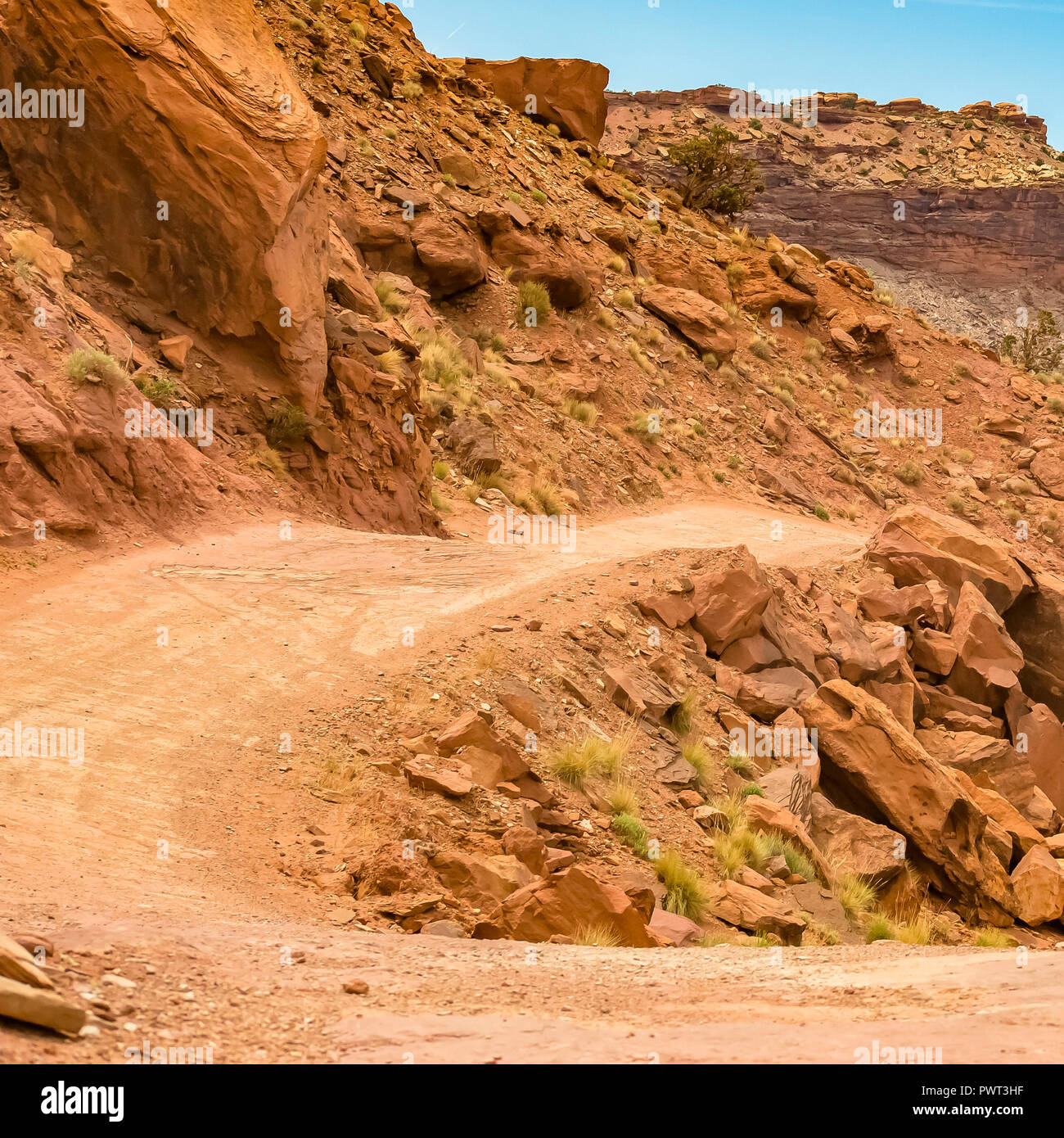 Curving trail on a rugged cliff in Moab Utah Stock Photo - Alamy