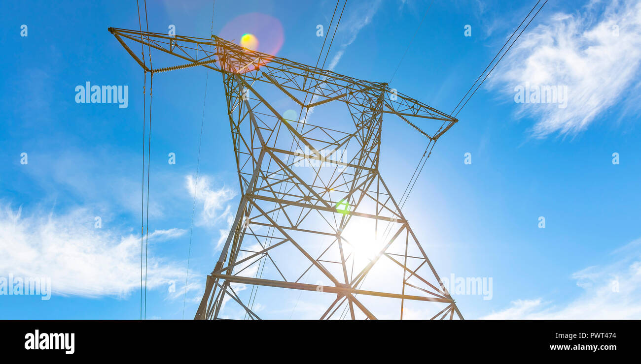 Electricity tower under a sunny sky with clouds Stock Photo - Alamy