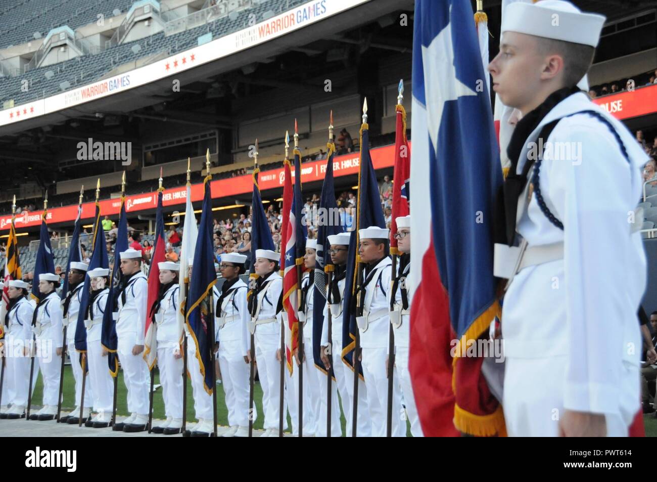 The Navy Honor Guard stands at attention during the Opening Ceremony ...