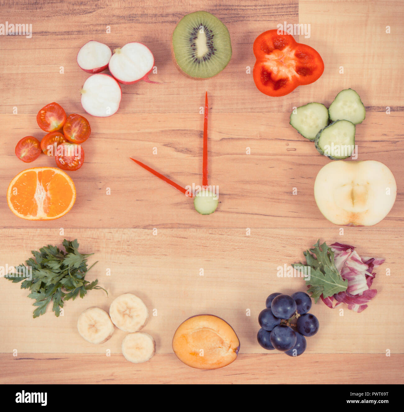 Fresh ripe fruits and vegetables in shape of clock, concept of time for ...