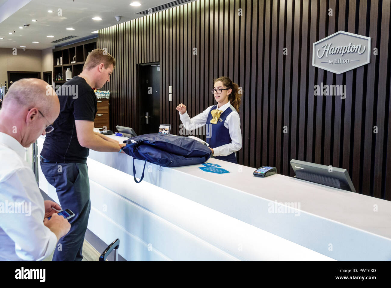 Lobby front reservations check in desk woman female guest hi-res stock ...