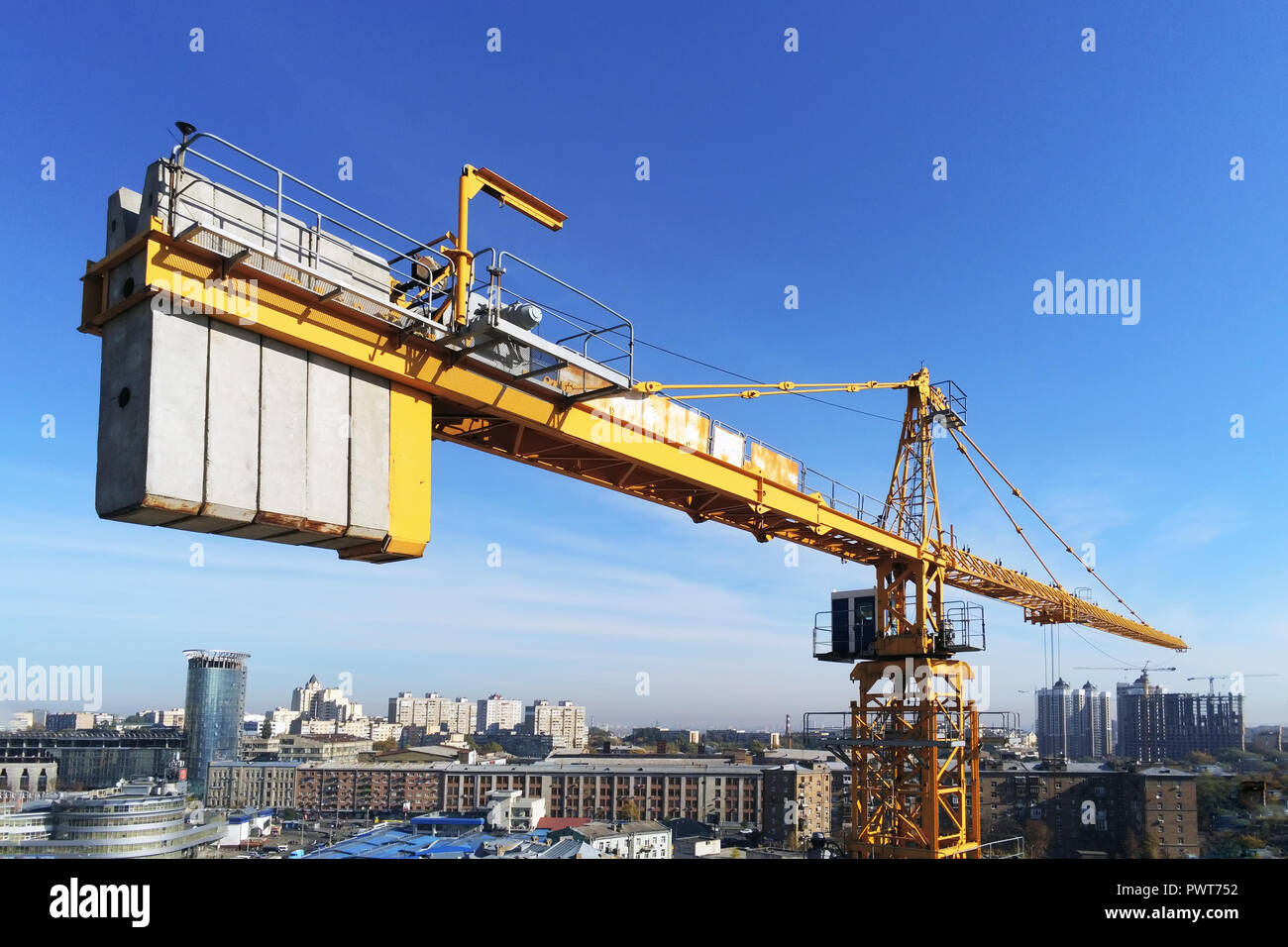 High building construction site. Big industrial tower crane with blue ...