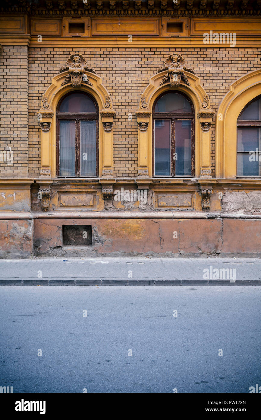 old building with a facade of yellow brick, view across the street ...
