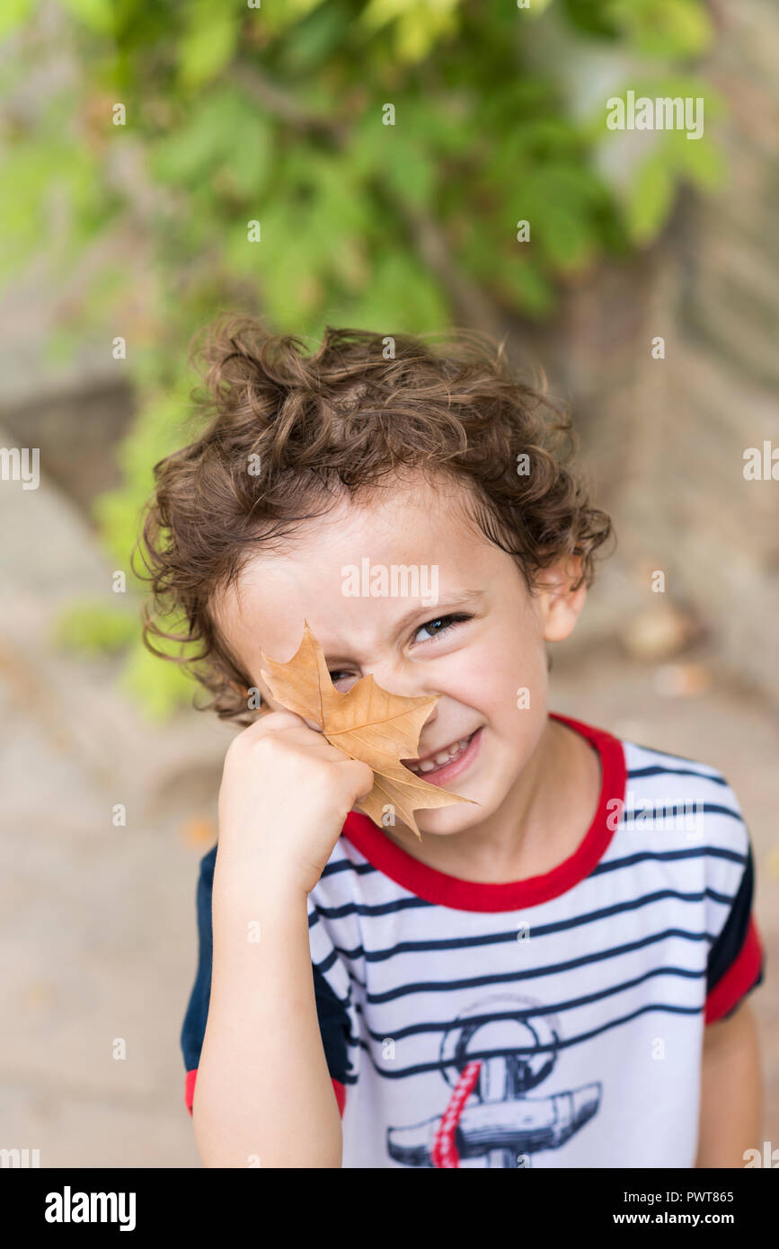 Child with leaf hi-res stock photography and images - Alamy