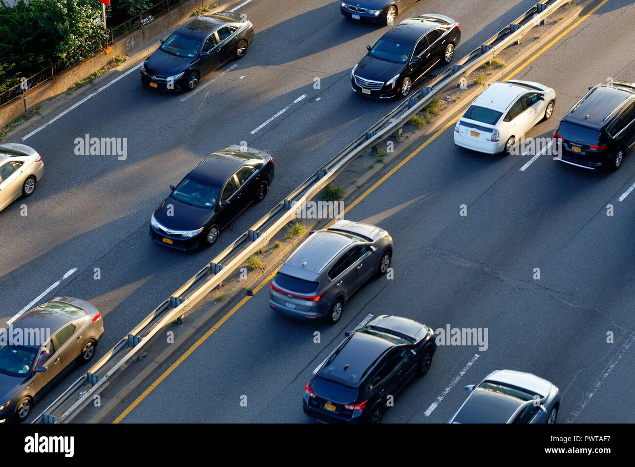Cars on both sides of a two-way highway with a divider Stock Photo - Alamy