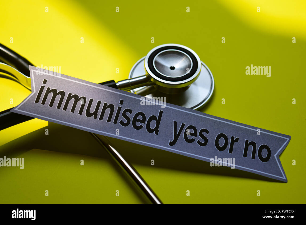 immunised yes or no with stethoscope concept inspiration on yellow ...