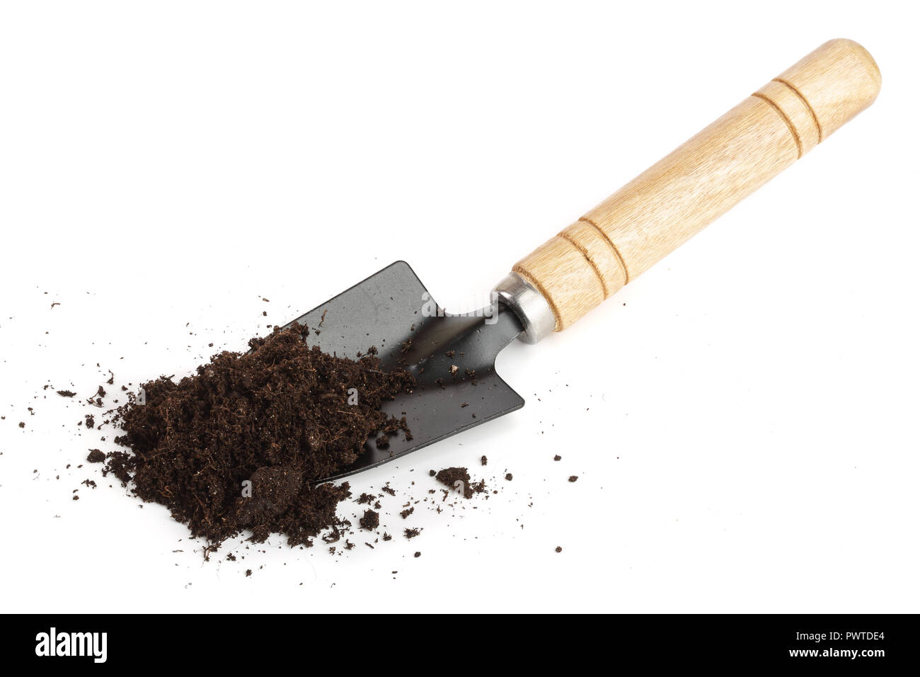 garden tools in soil isolated on white background Stock Photo - Alamy