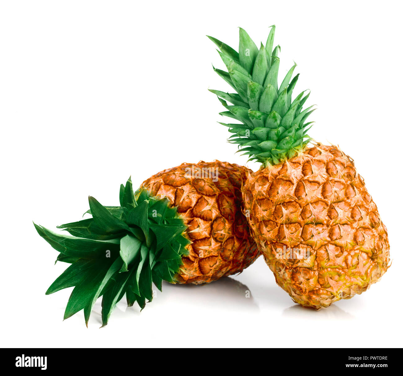 Two ripe pineapple isolated on white background Stock Photo - Alamy