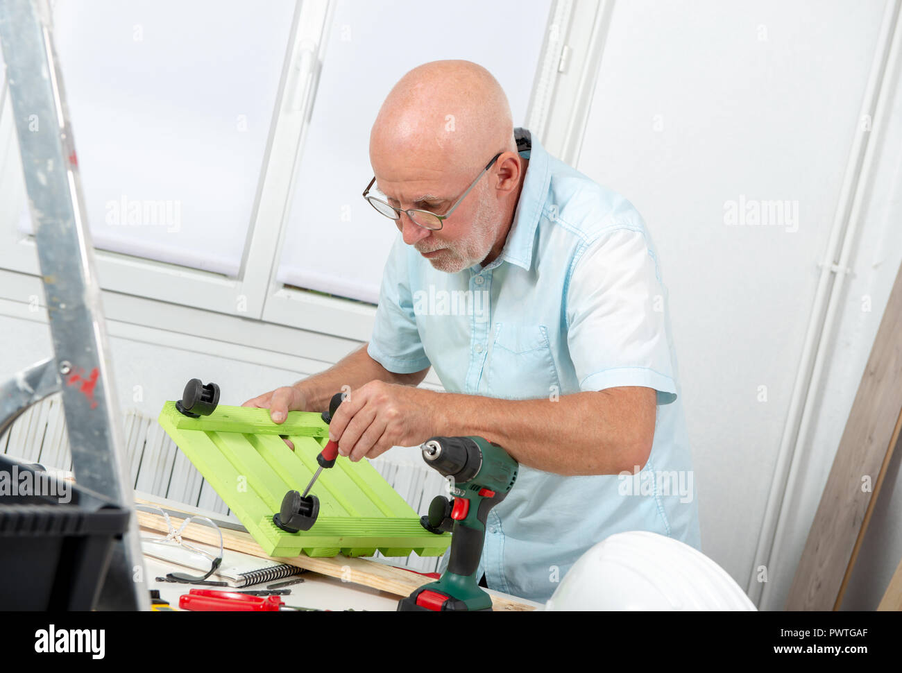Handyman mature home improvement working hi-res stock photography and ...