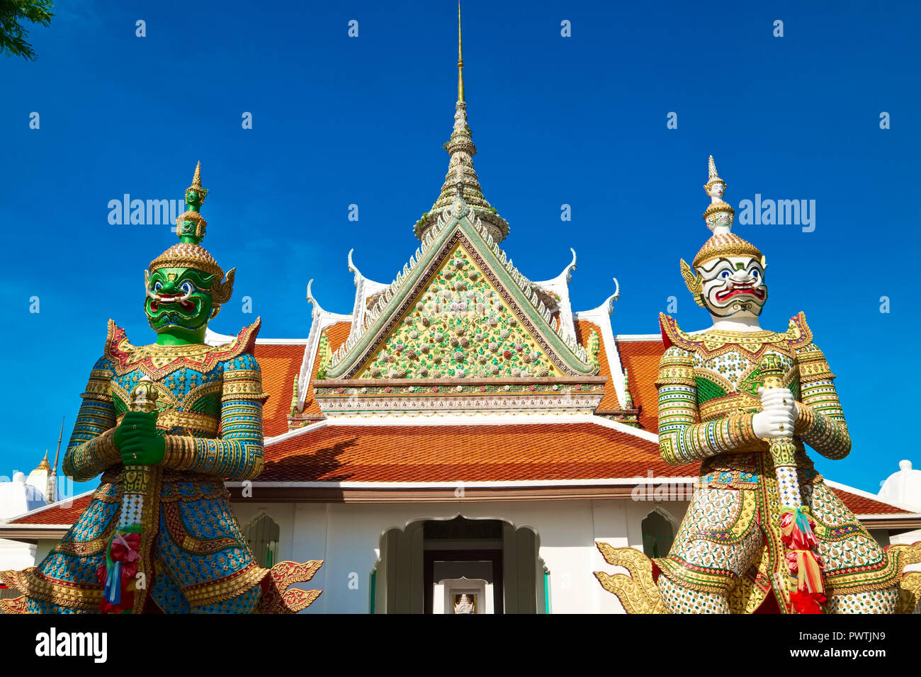 Two demonic Yak or Yaksha, temple guardians, at a side building of Wat ...