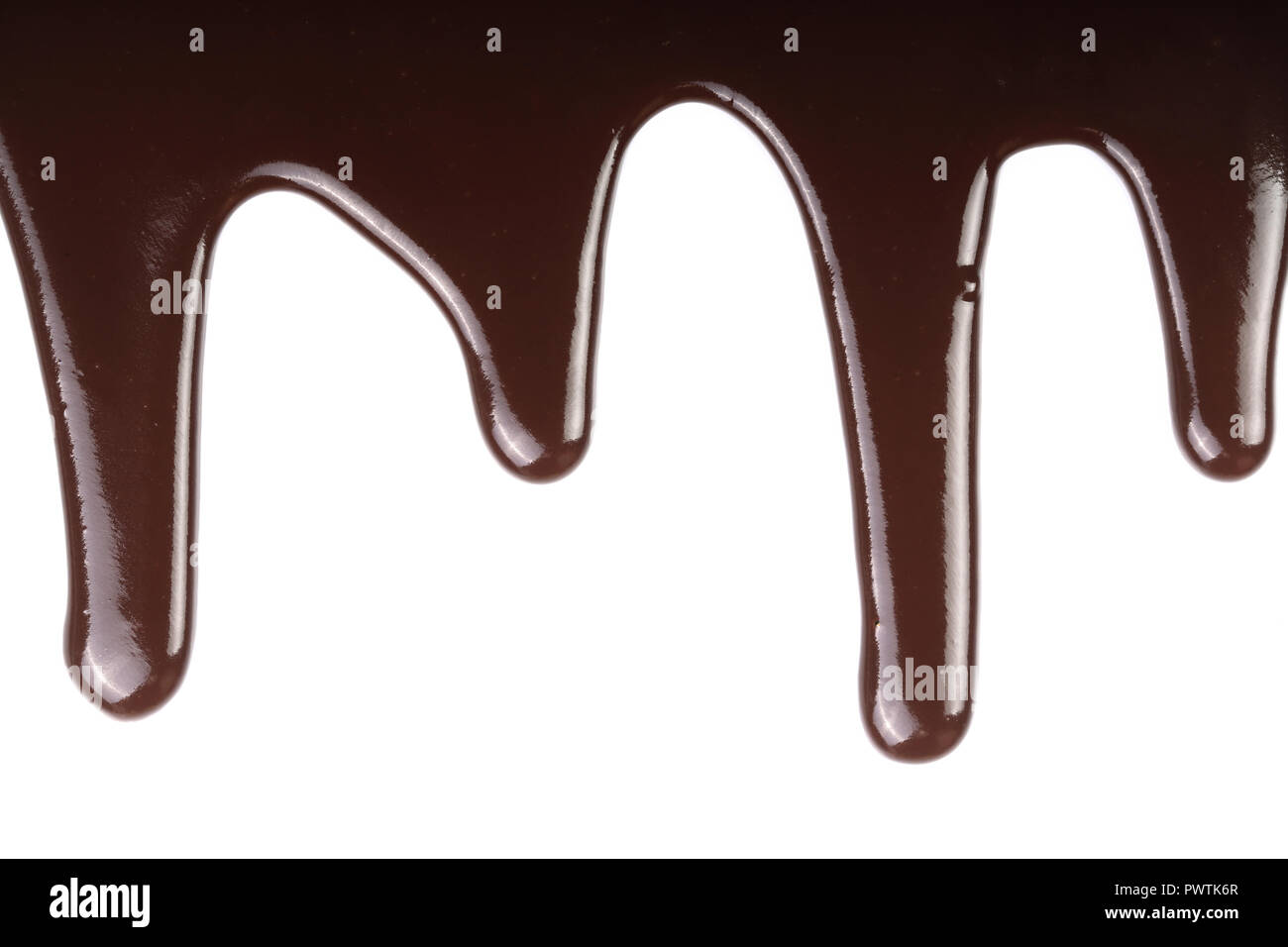 Melted chocolate dripping isolated on white background Stock Photo - Alamy