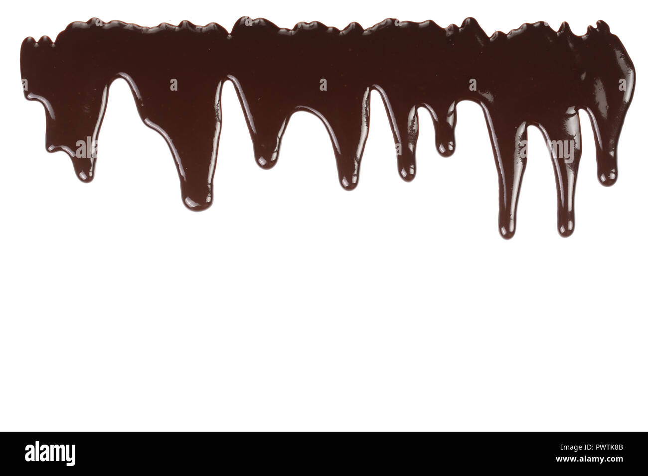 Melted chocolate dripping isolated on white background Stock Photo - Alamy