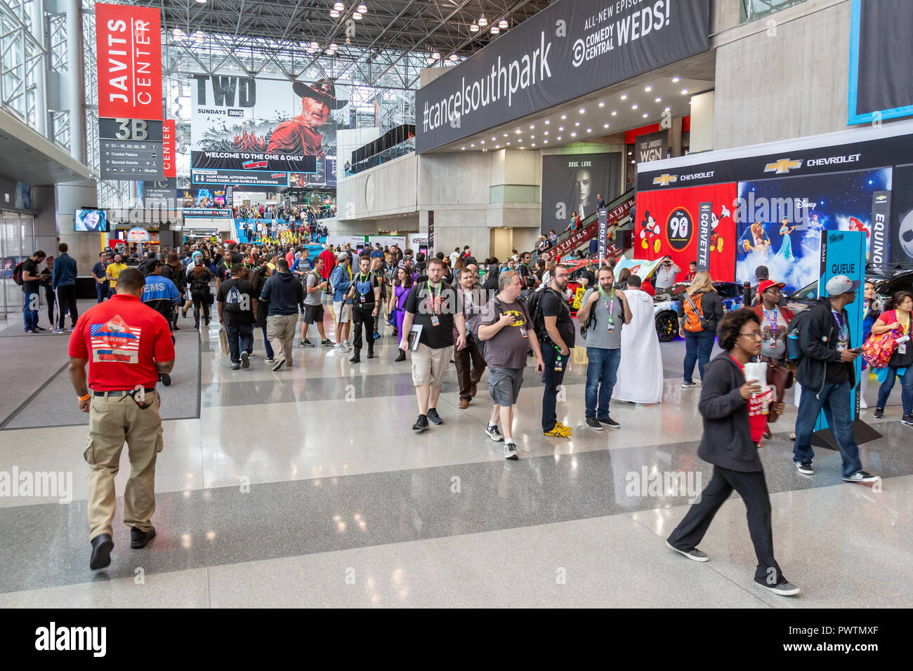 A crowd of visitors and fans to the New York Comic Con comic book and ...