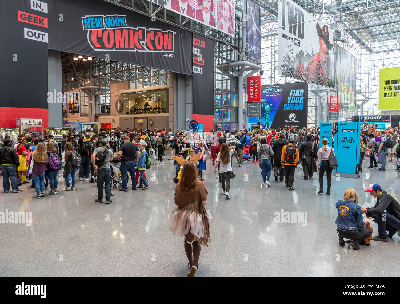 A crowd of visitors and fans to the New York Comic Con comic book and ...