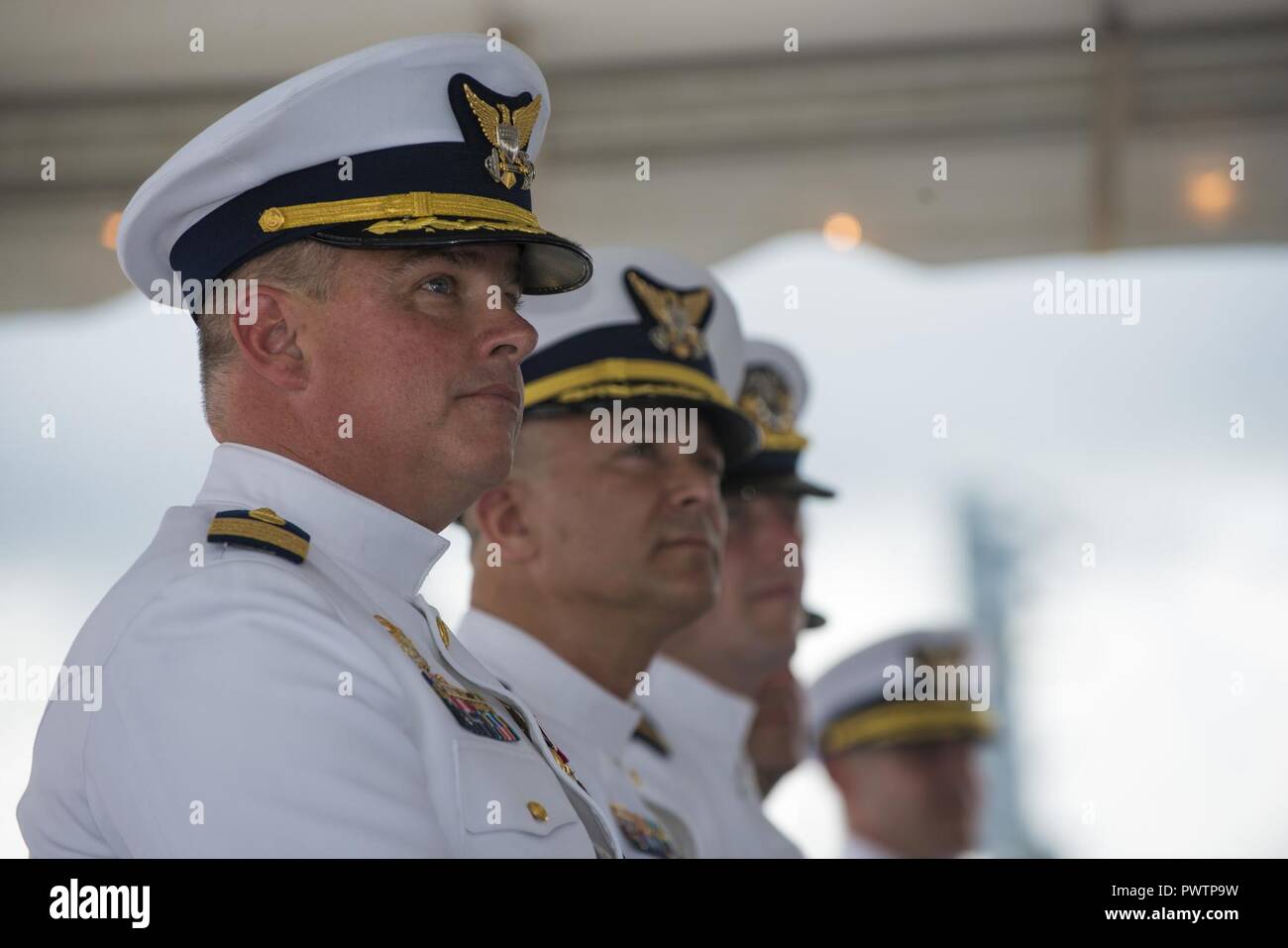 Capt. Scott Clendenin, far left, prepares to transfer command to Capt ...