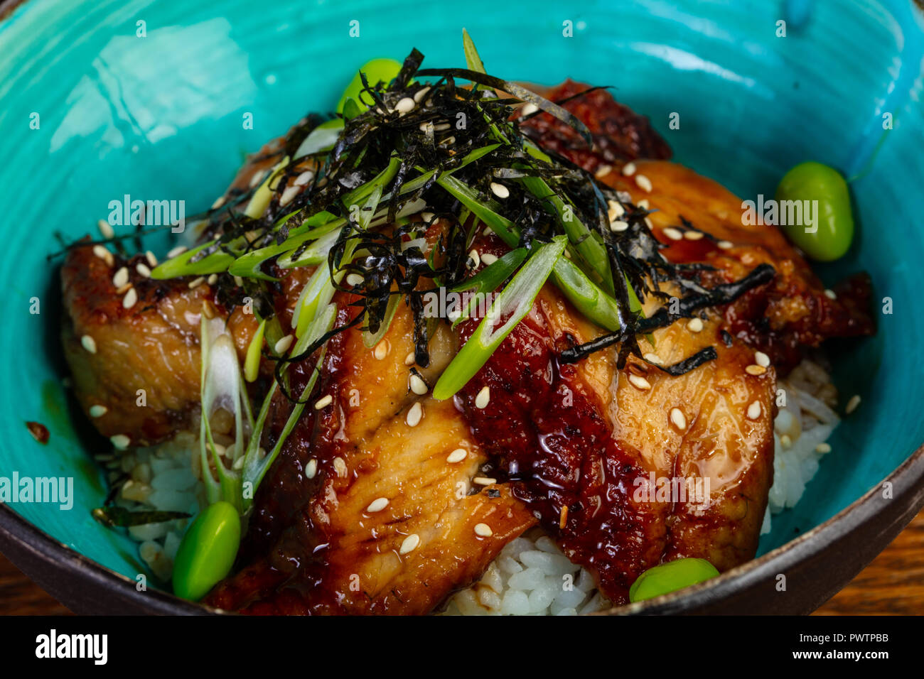 Rice with eel served sesame seeds Stock Photo - Alamy