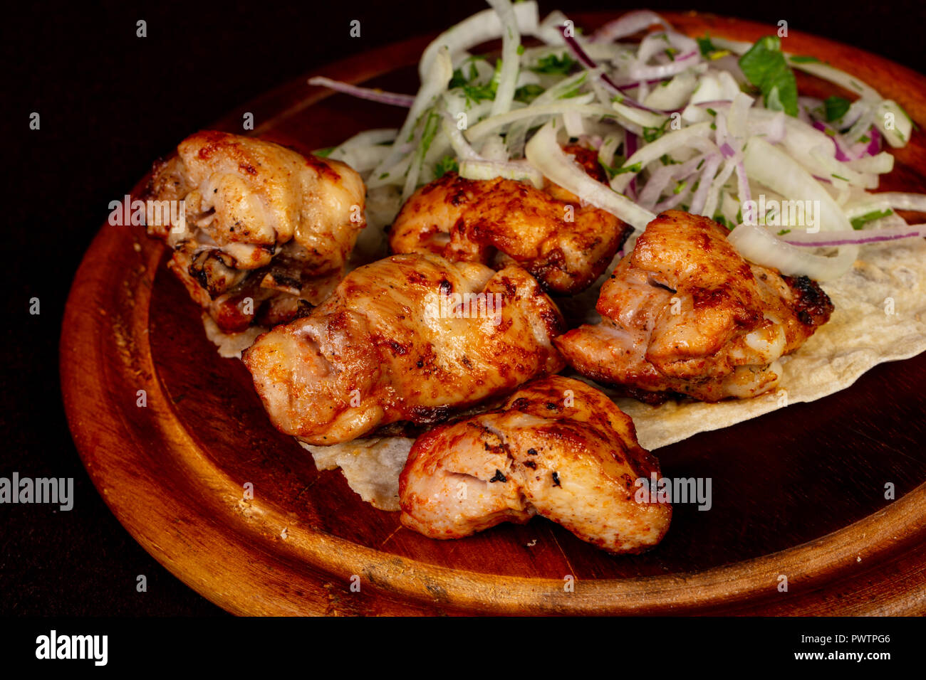 Chicken kebab shashlik served onion Stock Photo - Alamy