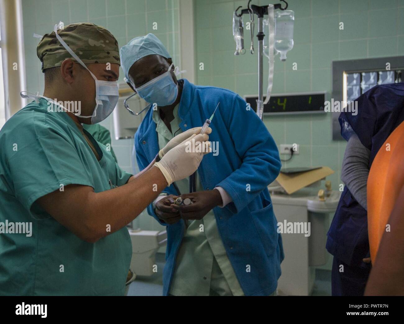 U.S. Army Maj. Fernando Lopez, a nurse anesthetist, prepares to ...