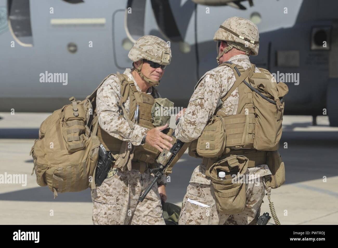 Commandant of the Marine Corps Gen. Robert B. Neller, left, shakes ...