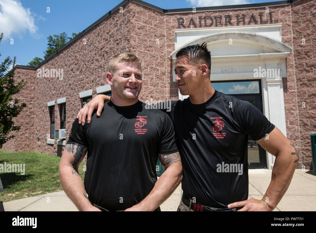 The Martial Arts Center of Excellence staff pose for a photo outside ...