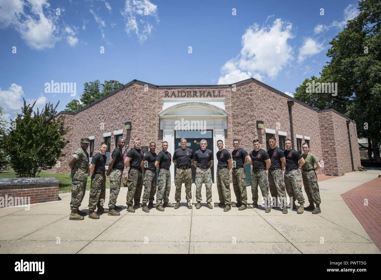 The Martial Arts Center of Excellence staff pose for a photo outside ...