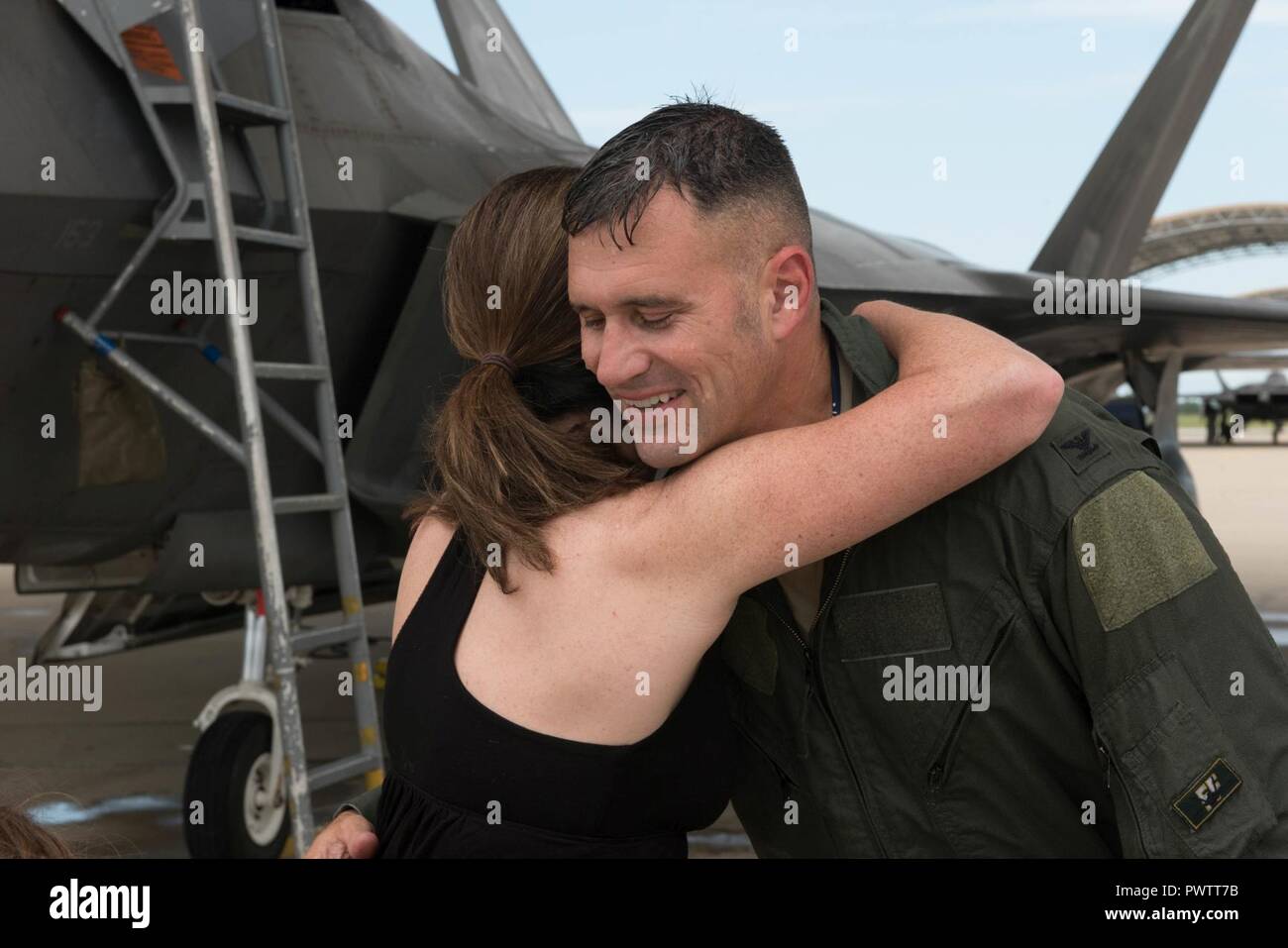 U.S. Air Force Col. Peter Fesler , 1st Fighter Wing commander, hugs his ...