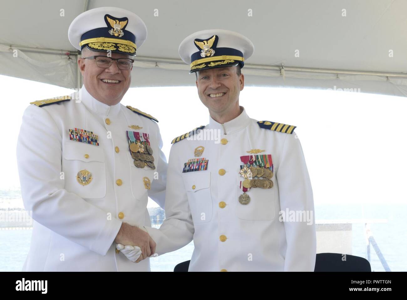 Capt. Jason Hamilton (right), former commanding officer of the Coast ...