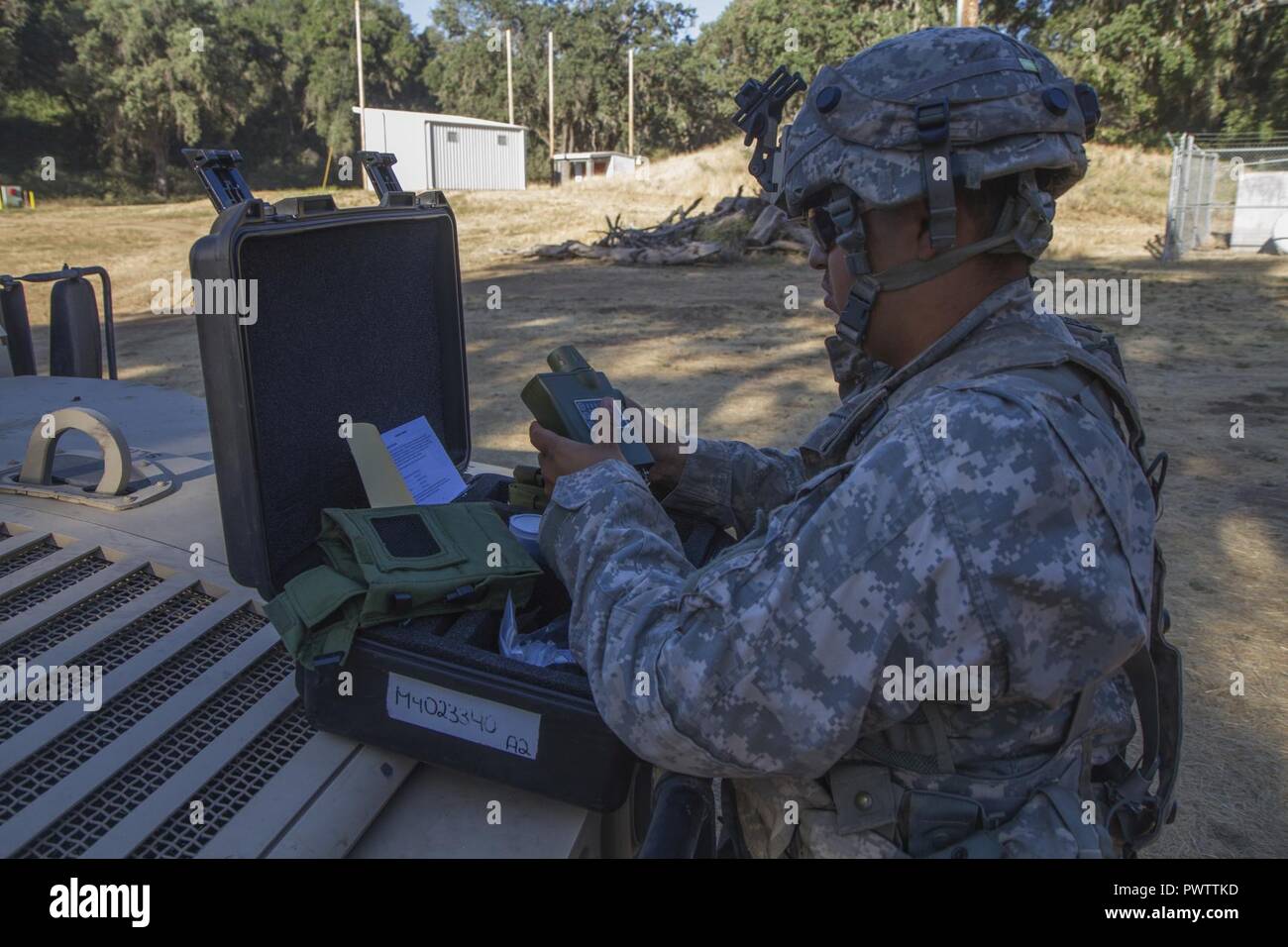U.S. Army Spc. Justin Farfan assembles a Joint Chemical Agent Detector ...
